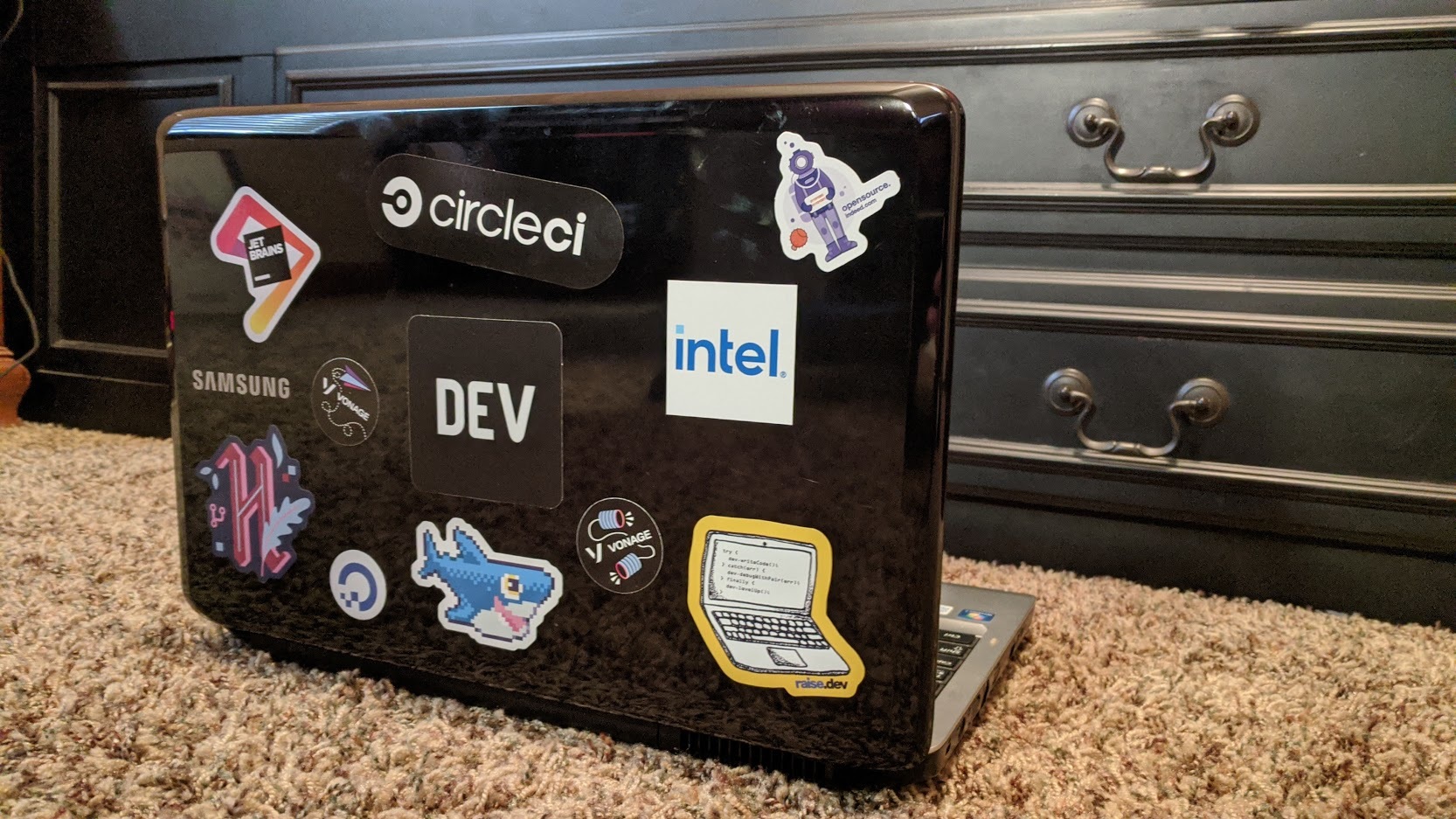 A laptop without stickers looks naked - DEV Community